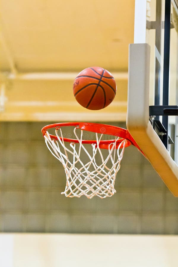 Basketball Heading To the Net at a Sports Arena with Lens Flare . Stock ...