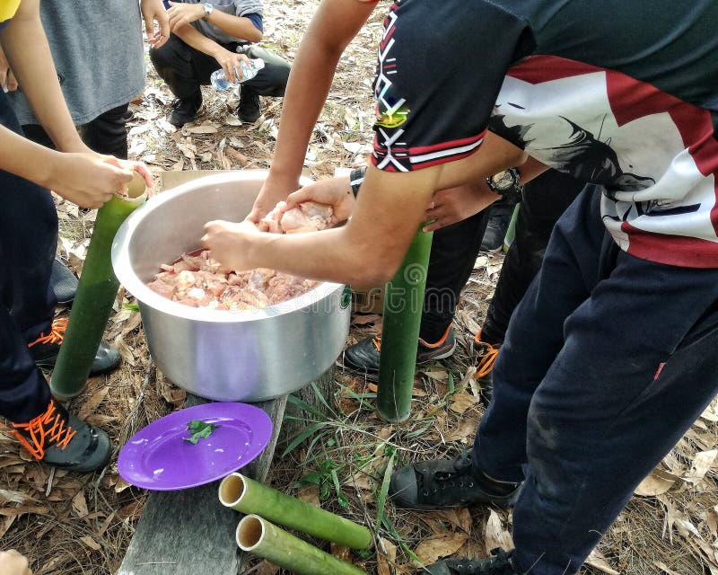 Boy Scout Cooking Sausages on Stick Over Campfire Stock Image - Image ...