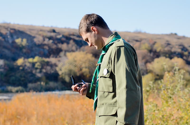 Scout Master Reading a Compass Outdoors Stock Image - Image of nature ...