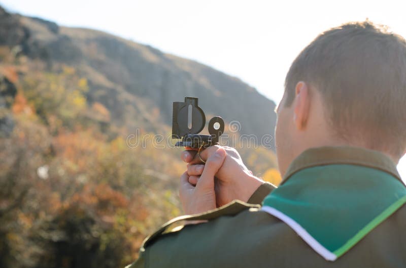 Scout Navigating in the Wilderness with Compass Stock Image - Image of ...