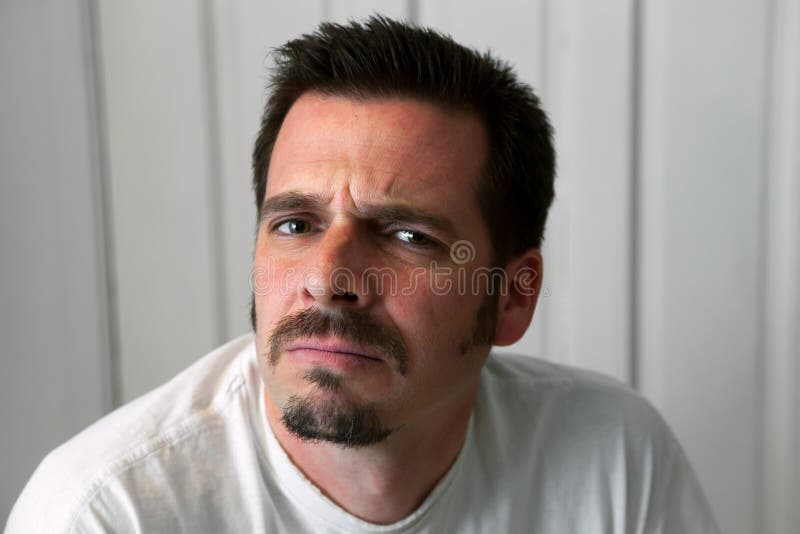 Scowling Man with Goatee stock photo. Image of frowning - 70518180