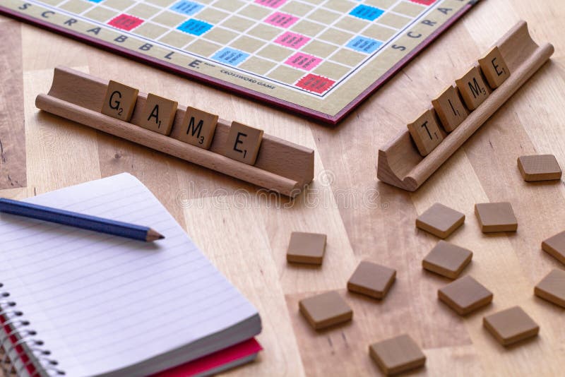 Scrabble Board Game with the Scrabble Tile Spell `Game Time` Editorial ...