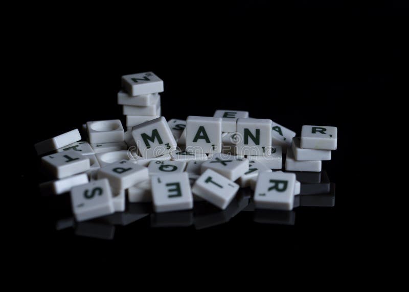 Scrabble Letters on Reflective Surface Word Man Editorial Stock Photo ...