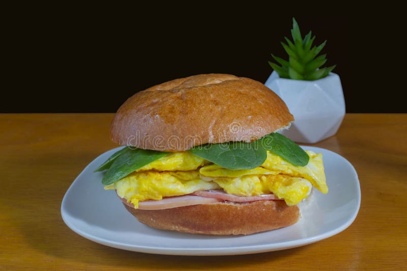 Scramble Egg with Canadian Bacon and Spinach on Brioche Roll Stock ...