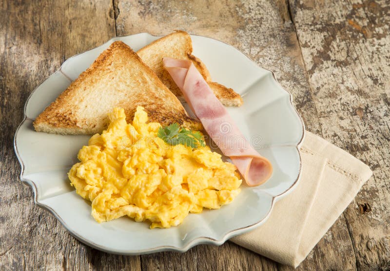 Scrambled Eggs with Crusty Bread and Bacon - Delicious Breakfast Stock ...