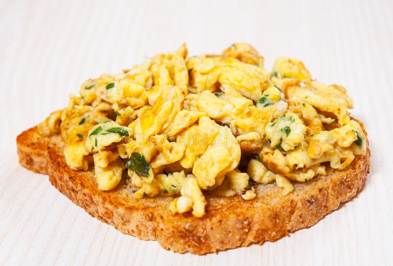 Scrambled eggs on bread. stock image. Image of toast - 60420027
