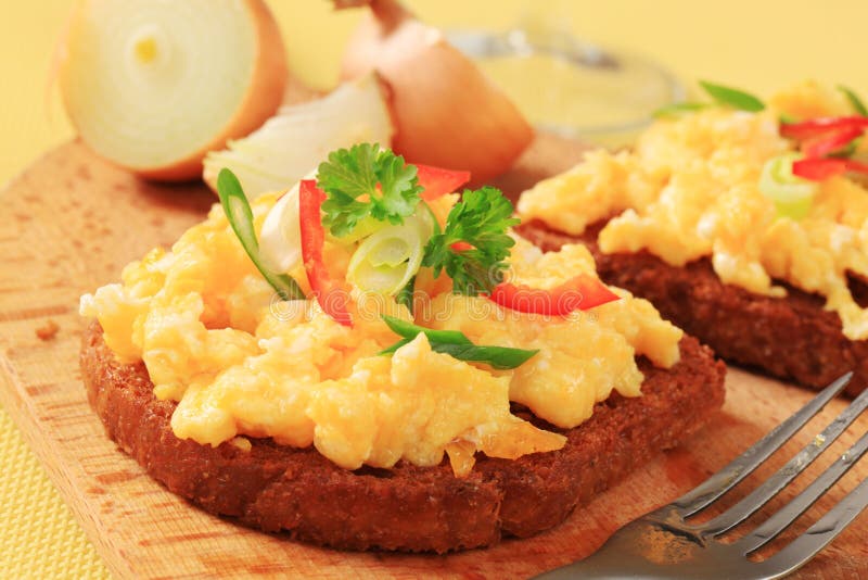 Scrambled Eggs on Fried Bread Stock Photo - Image of toast, snack: 18997024