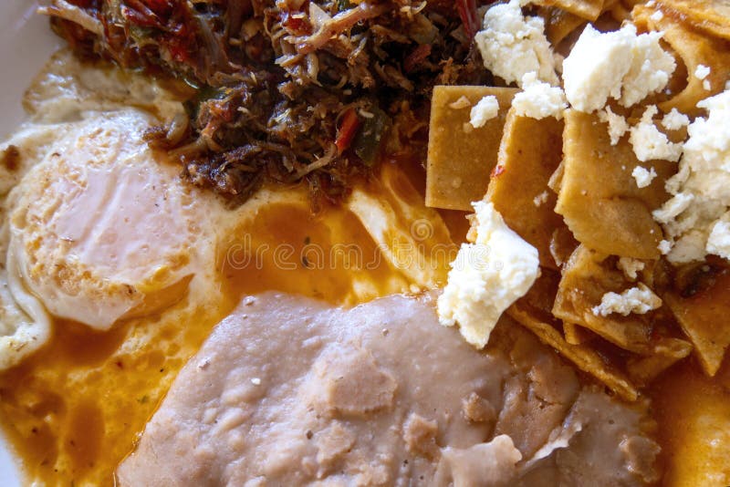 Scrambled Eggs with Machaca and Beans and Chilaquiles Stock Image ...