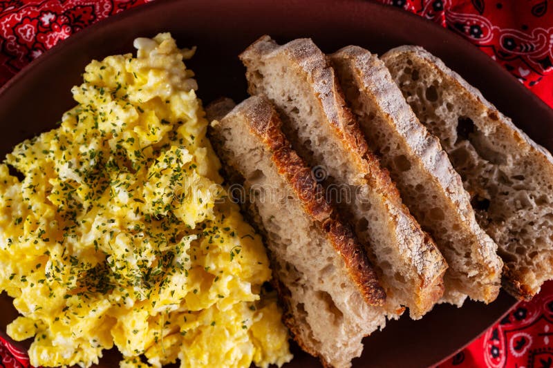 Scrambled Eggs and Slices of Artisan Bread Stock Image - Image of ...