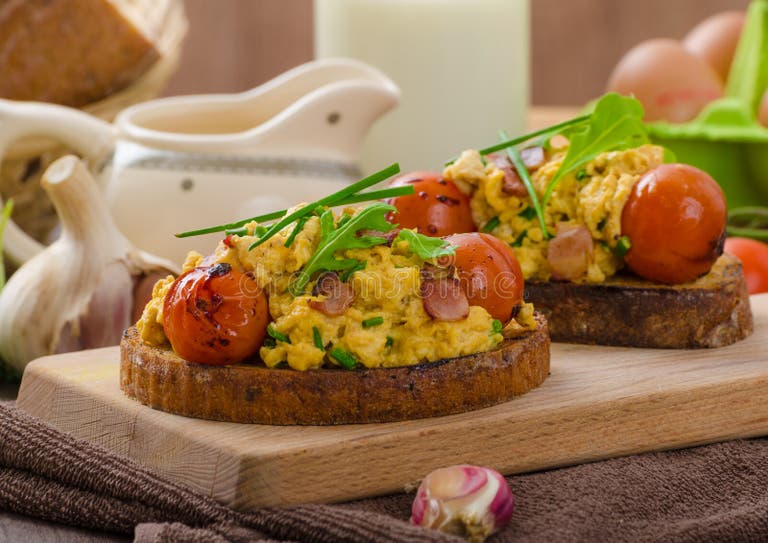 Scrambled Eggs Witch Bacon, Herbs and Tomato Stock Image - Image of ...