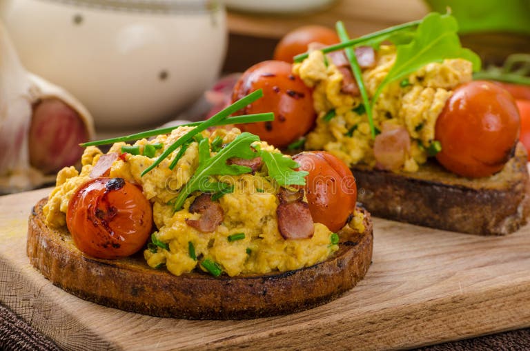 Scrambled Eggs Witch Bacon, Herbs and Tomato Stock Image - Image of ...