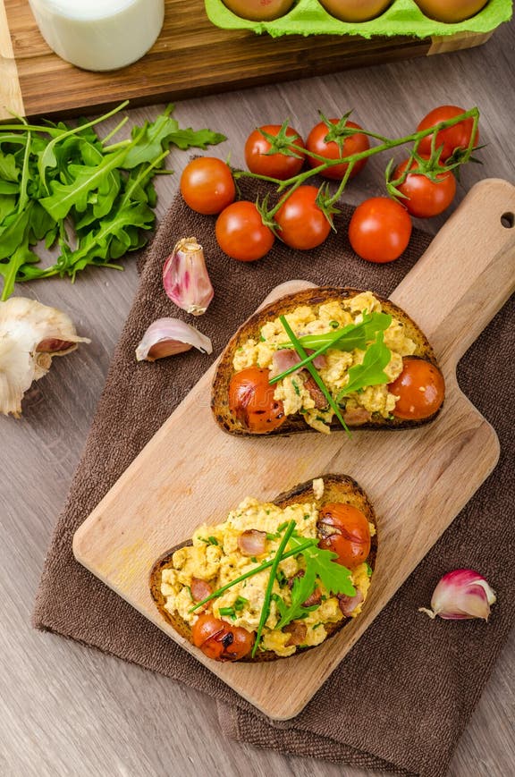 Scrambled Eggs Witch Bacon, Herbs and Tomato Stock Image - Image of ...