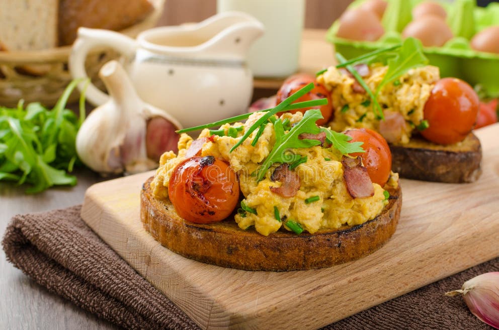 Scrambled Eggs Witch Bacon, Herbs and Tomato Stock Photo - Image of ...