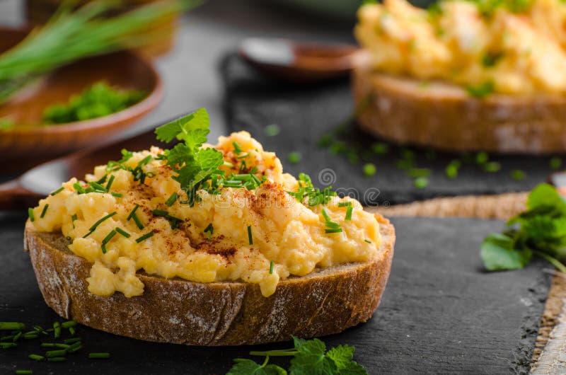 Scrambledd Eggs with Chive and Chilli Stock Photo - Image of dish ...