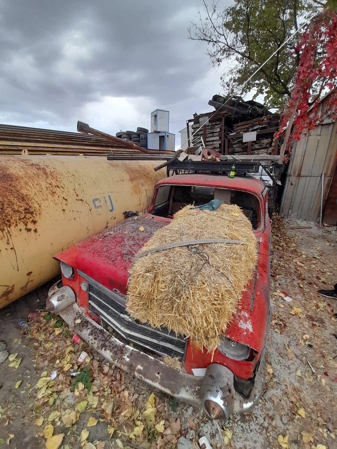 Scrap van with straw on it stock photo. Image of sculpture - 200414026