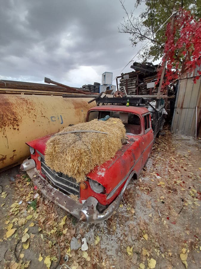 Scrap van with straw on it stock photo. Image of waterway - 200414236