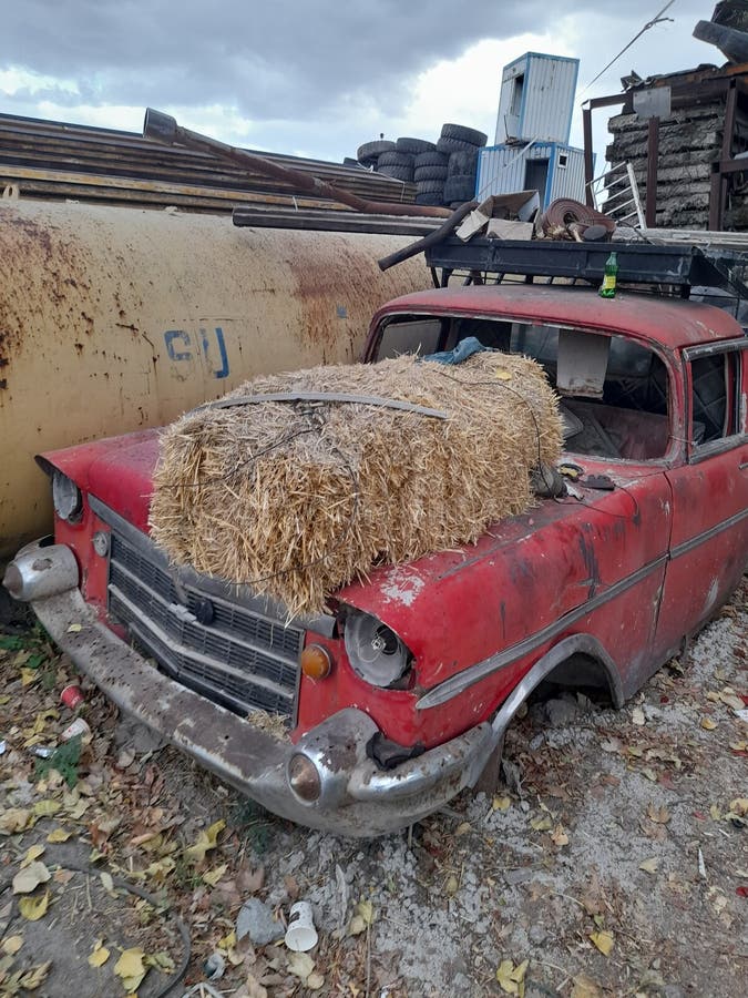 Scrap van with straw on it stock image. Image of track - 200415075