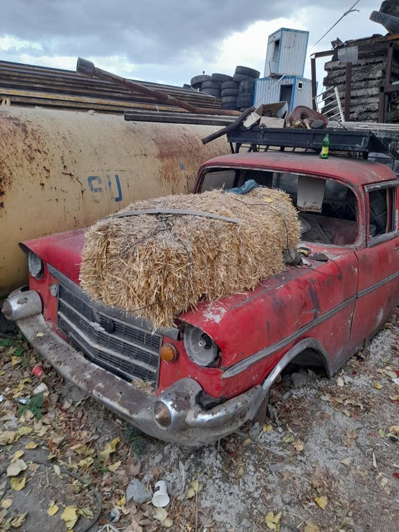 Scrap van with straw on it stock image. Image of track - 200415075