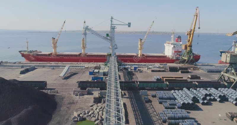 Scraper Conveyors in the Port, in the Background Bulk Carriers Stock ...