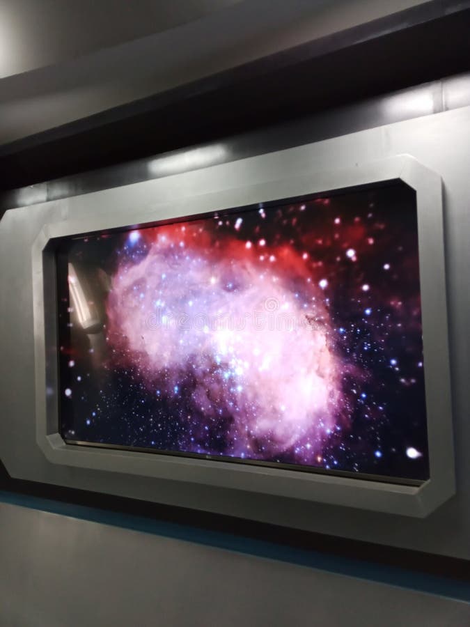 A Screen Displays a Nebula in Space. Stock Photo - Image of asian ...
