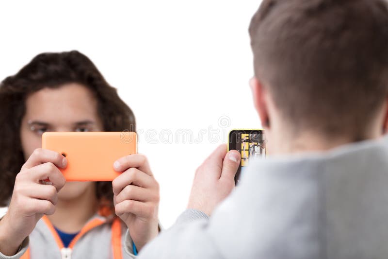 Screen Fixation while Socializing Stock Photo - Image of devices, youth ...