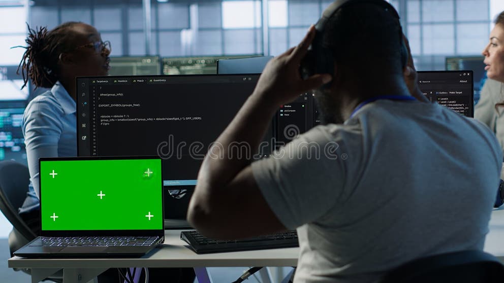 Screen Laptop Next To Programmer Coding in Server Farm Stock Photo ...