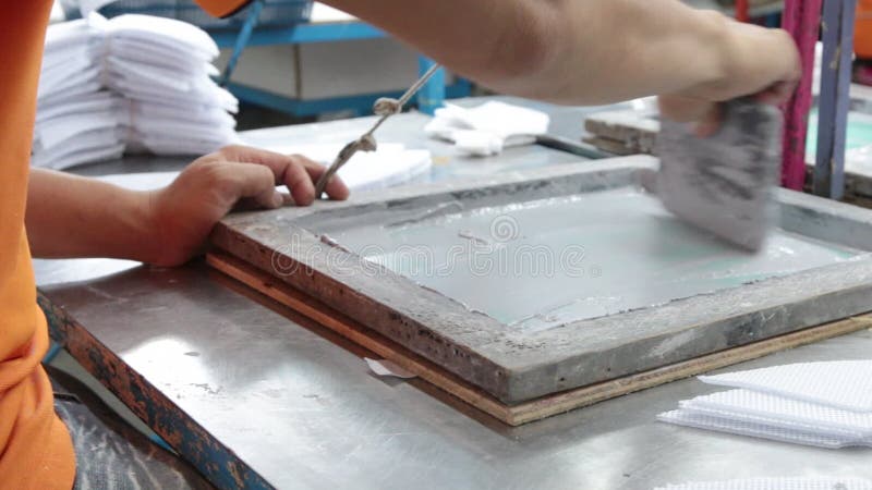 A Screen Printing Worker Looks Busy Mixing Screen Printing Ink in a Jar ...