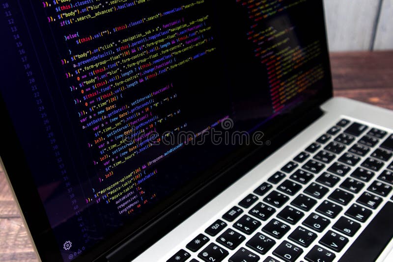 The Screen Of The Program Source Code On The Laptop Placed On The Desk Which The Programmer Has