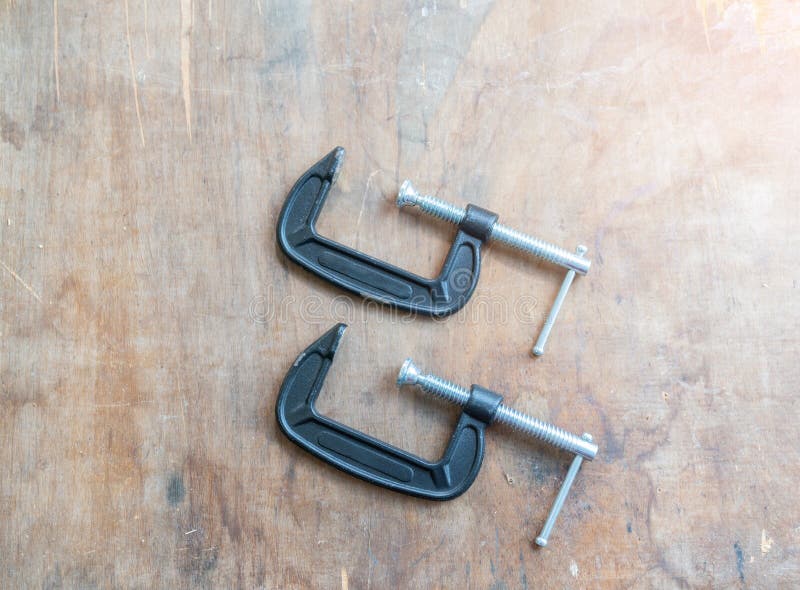 2 Clamp Paste on Wood Table in Workshop Stock Image - Image of angle ...