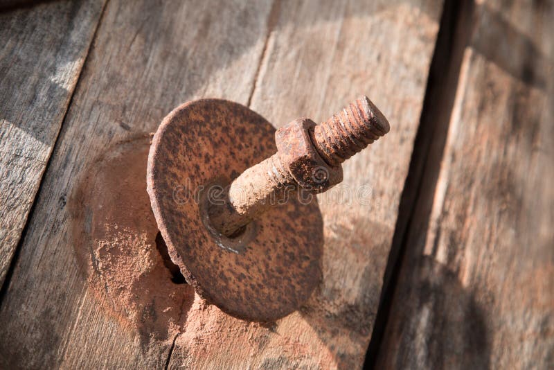 The Nut is Rust on Old Wood Stock Photo - Image of industrial, element ...