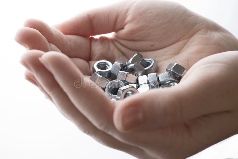 Screw-nuts in hands stock image. Image of fasteners - 202031131