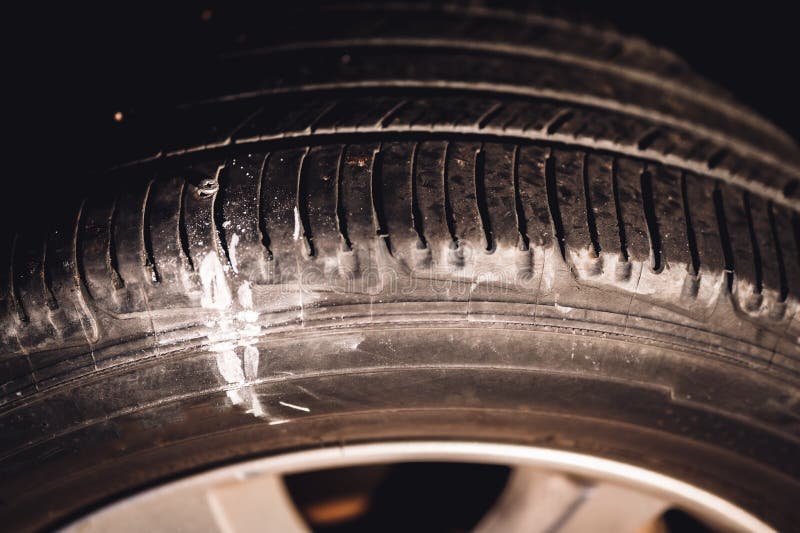 Protruding from the Tread of a Tire Causing a Flat. Stock Image - Image ...