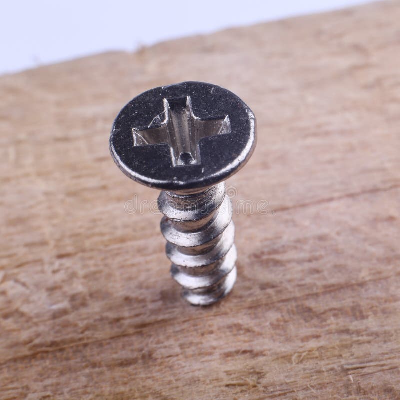 Screwed into Wooden Plank stock photo. Image of renovation - 60917586