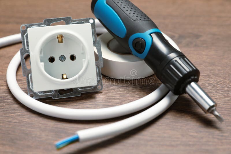 Screwdriver, Cable, Insulating Tape and Power Socket on Wooden Table ...