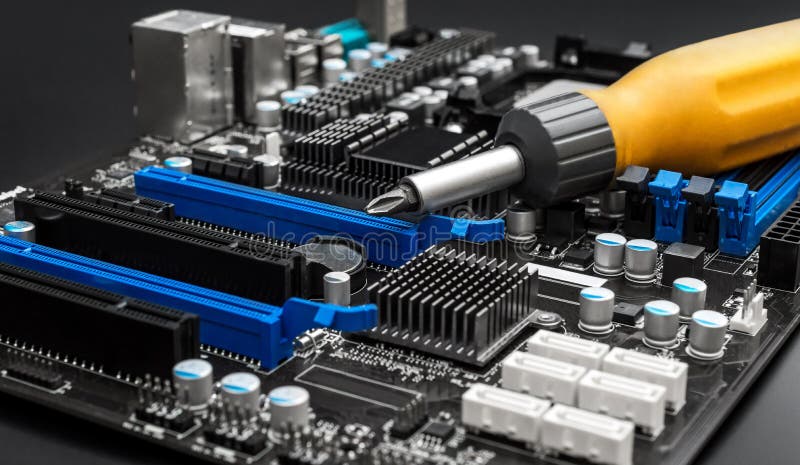 Screwdriver on Computer Motherboard. Computer Service Concept Stock ...