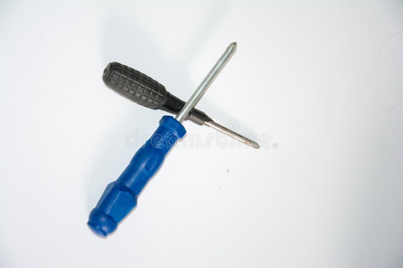 A Still Life with a Blue and Black Double Handle Screwdriver Placed on ...