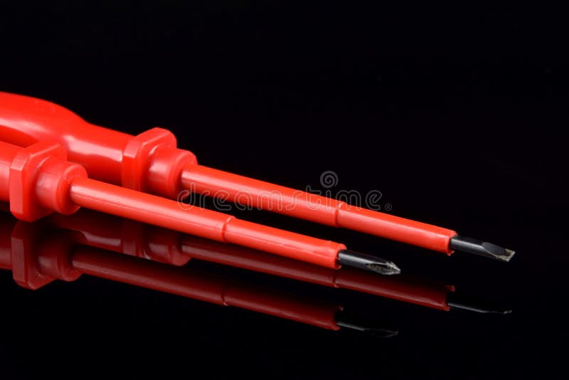 Screwdriver Flat and Screwdriver Cross. Workshop Tools. Reflection in ...