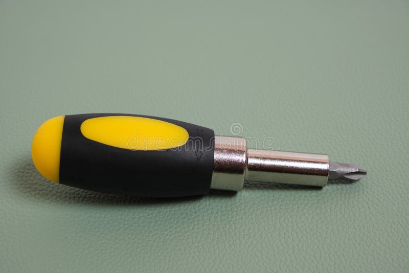Screwdriver on a Green Background Stock Image - Image of steel, work ...