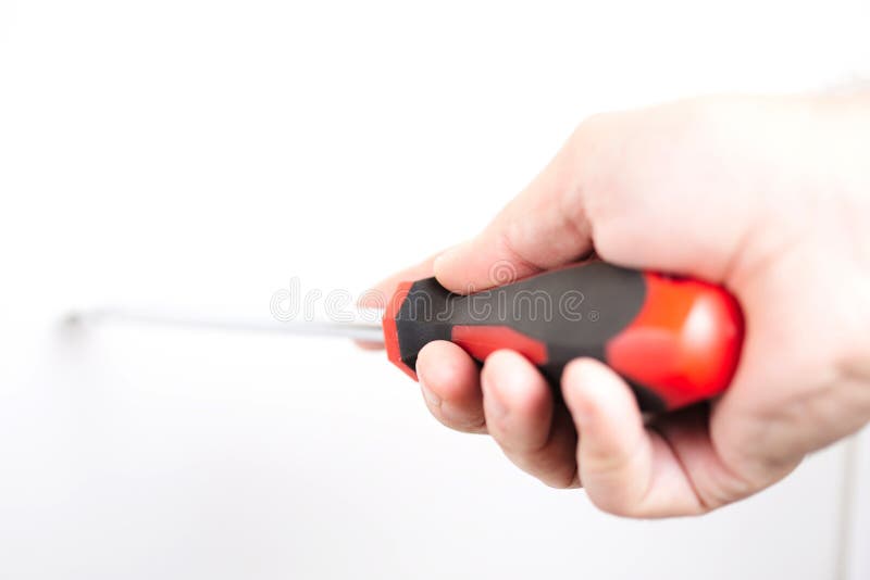 Screwdriver in the hand stock image. Image of hold, construction - 61091041