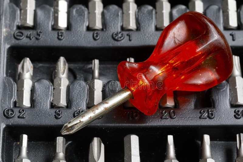 A Screwdriver with a Red Handle Placed on a Toolbox Stock Image - Image ...