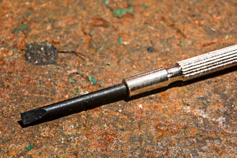 Screwdriver on a Metal Surface Close Stock Photo - Image of metallic ...