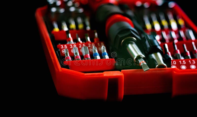 Screwdriver in Red Plastic Box with Various Replaceable Tips Stock ...