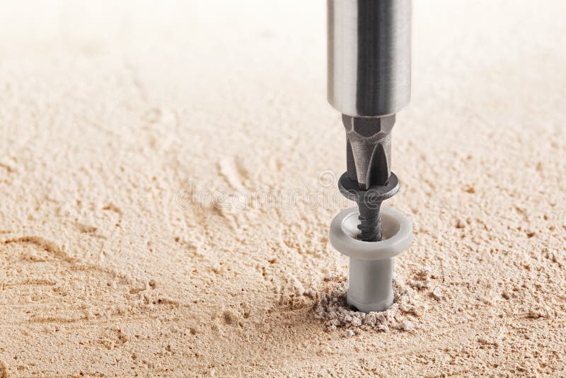 Screwdriver and Dowel in a Concrete Wall Background Stock Image - Image ...