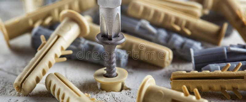 Screwdriver and Dowel in a Concrete Wall Background Stock Photo - Image ...