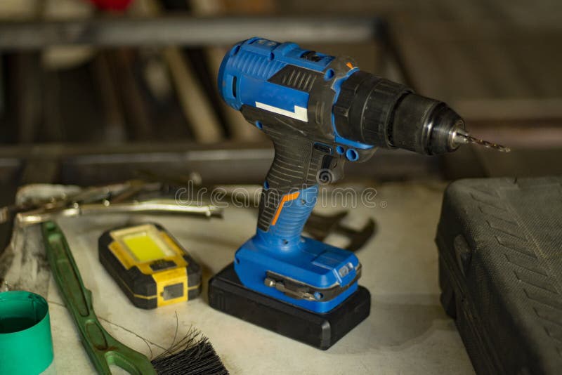 Screwdriver on the Table. Electric Tool in the Garage. Electric ...