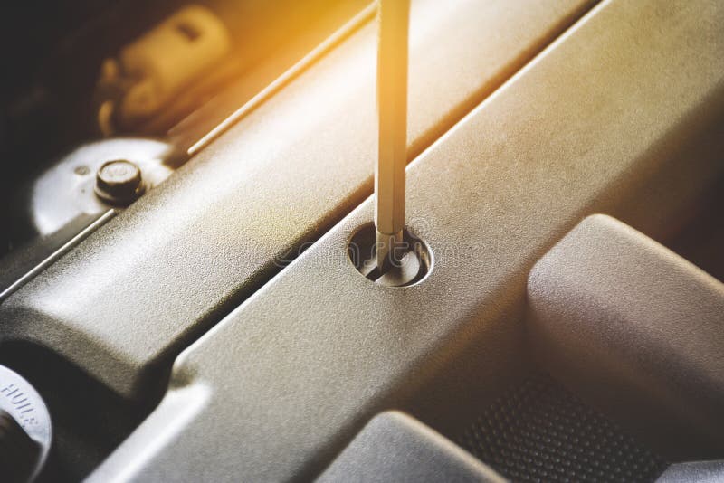 Screwdriver is Unscrewing To Car Fastener Clips Stock Image - Image of ...