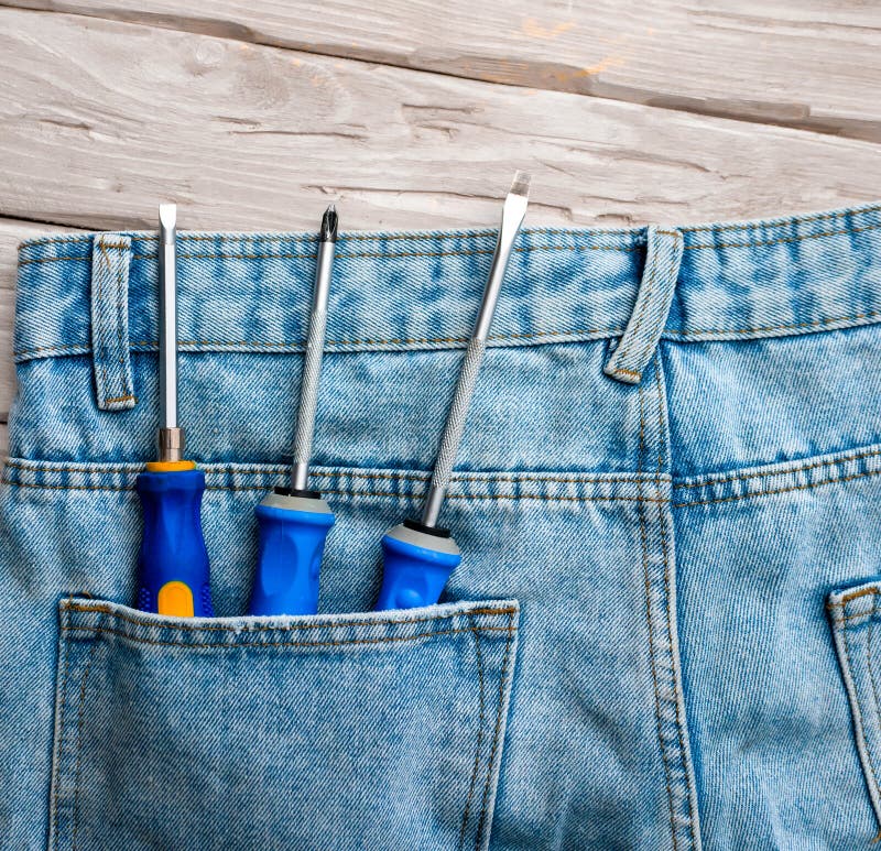 Screwdrivers Different Set in the Pocket of Denim Pants. the Concept of ...