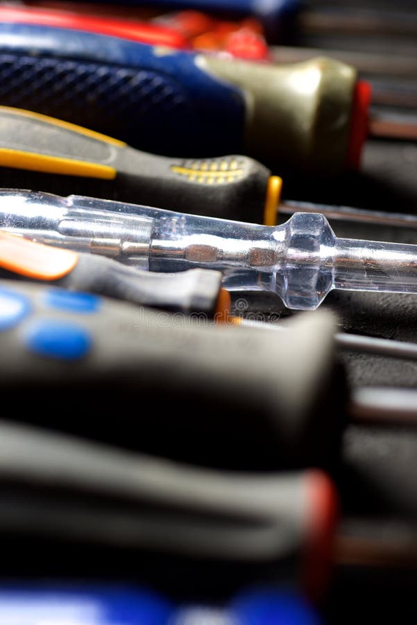 Screwdrivers of Different Sizes on a Black Table Stock Photo - Image of ...