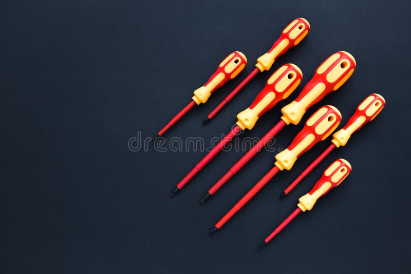 Screwdrivers. a Set of Bright Colored Screwdrivers on a Dark Background ...