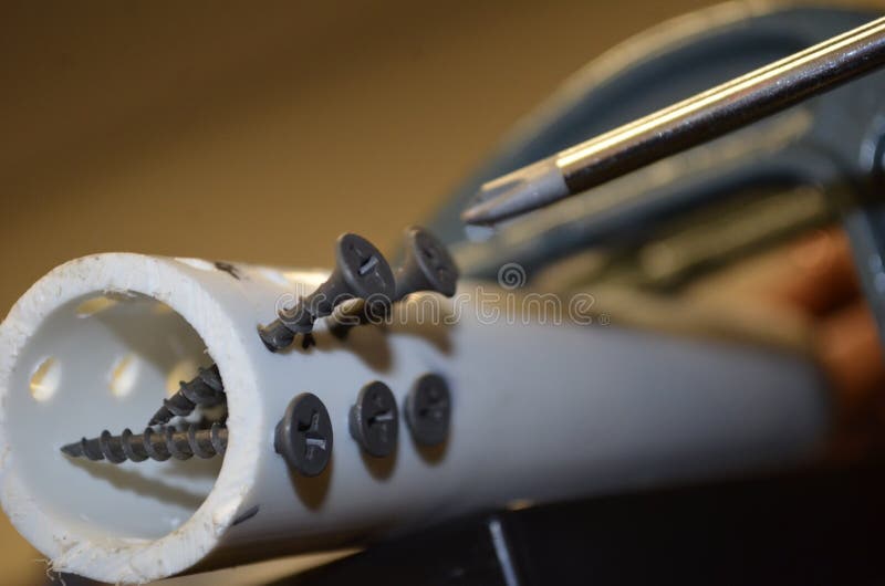 Screwing in screws stock image. Image of screwdriver - 50760527